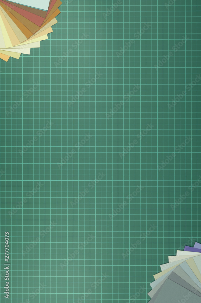 Top down view of cutting mat with colour swatches placed in opposite ...