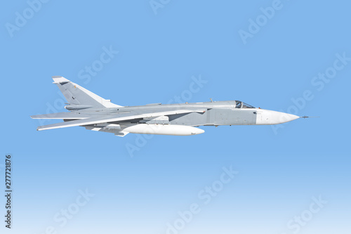 white fighter bomber jet isolated on blue sky background aerial side ...
