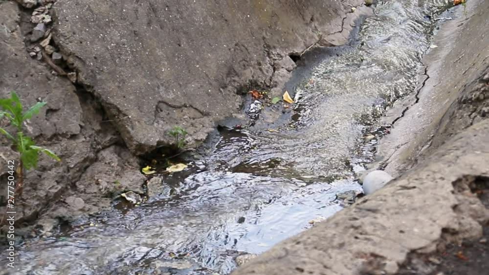 Sewage from the sewer. Waste water flow to sewer with bad water from ...