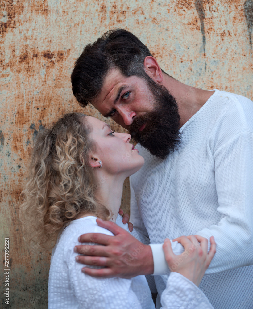 Passionate man gently kissing beautiful woman with desire. Love story ...