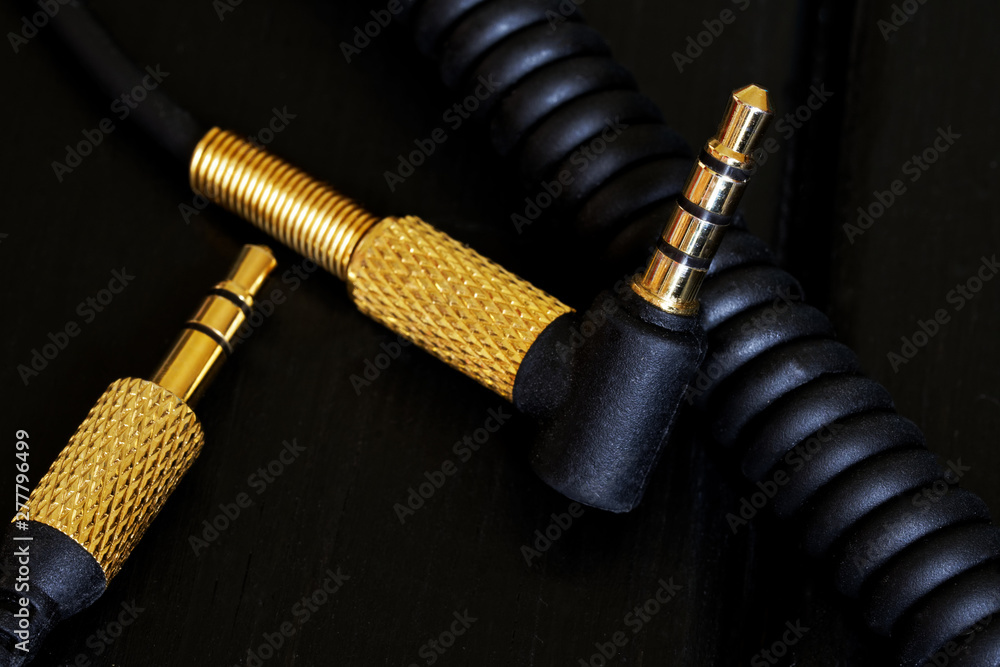 Gold-plated metal audio connectors with a diameter of 3.5 mm next to ...
