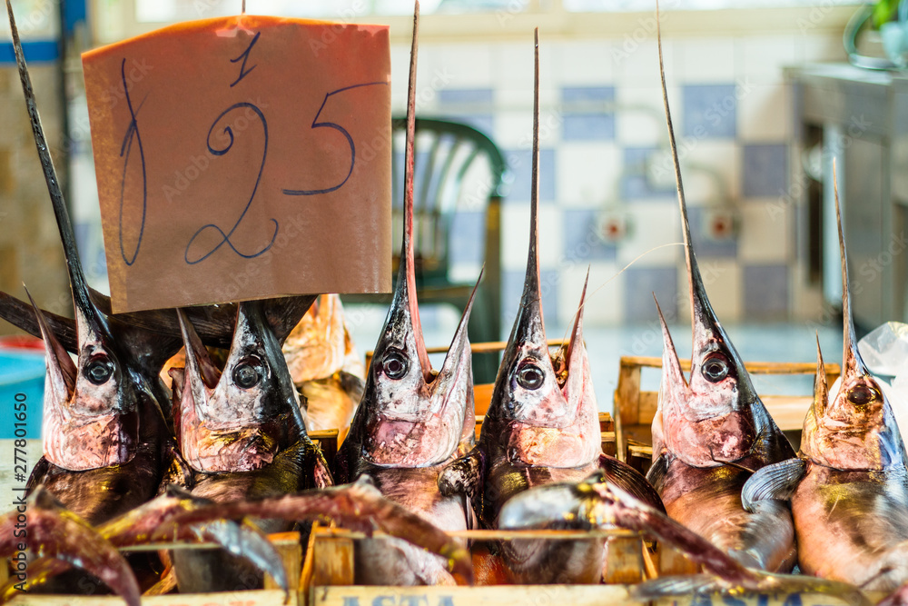 Poster Fresh swordfish being sold at the traditional sicilian fish ...