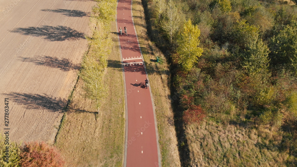 Aerial view upon a bicycle highway path with cyclists in The ...