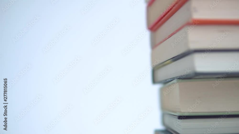 Close-up of the books at the stake. Smooth movement from right to left ...