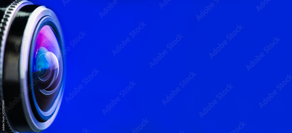 Banner. Camera lens with blue backlight. Side view of the lens of ...