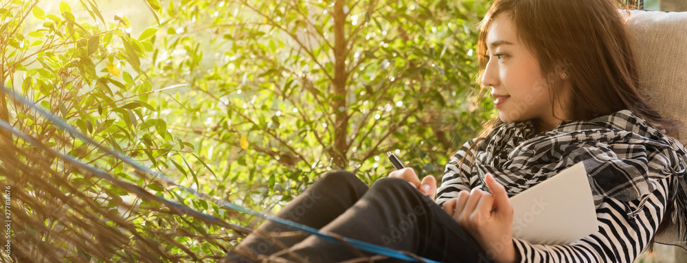 Beautiful young teenage woman write note onwhite notebook, dimension ...