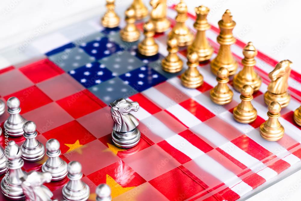 Chess board game pieces on USA and China flag background, trade war ...