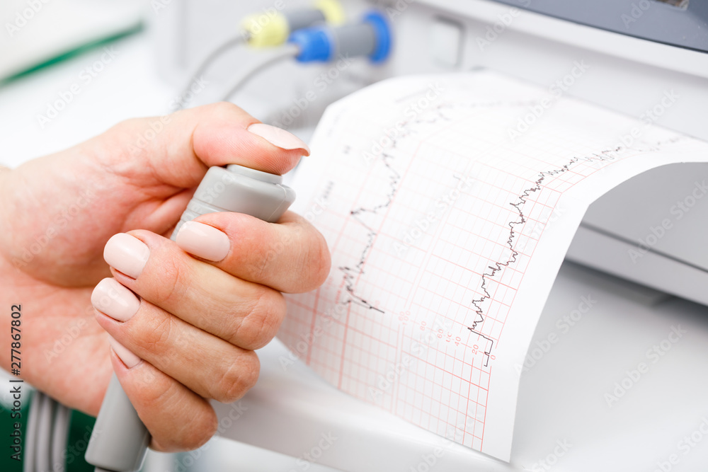Pregnant woman performing cardiotocography CTG monitoring fetal ...