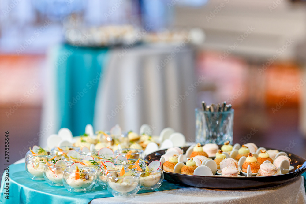 Tables in the restaurant with snacks and dishes. easy food for guests ...