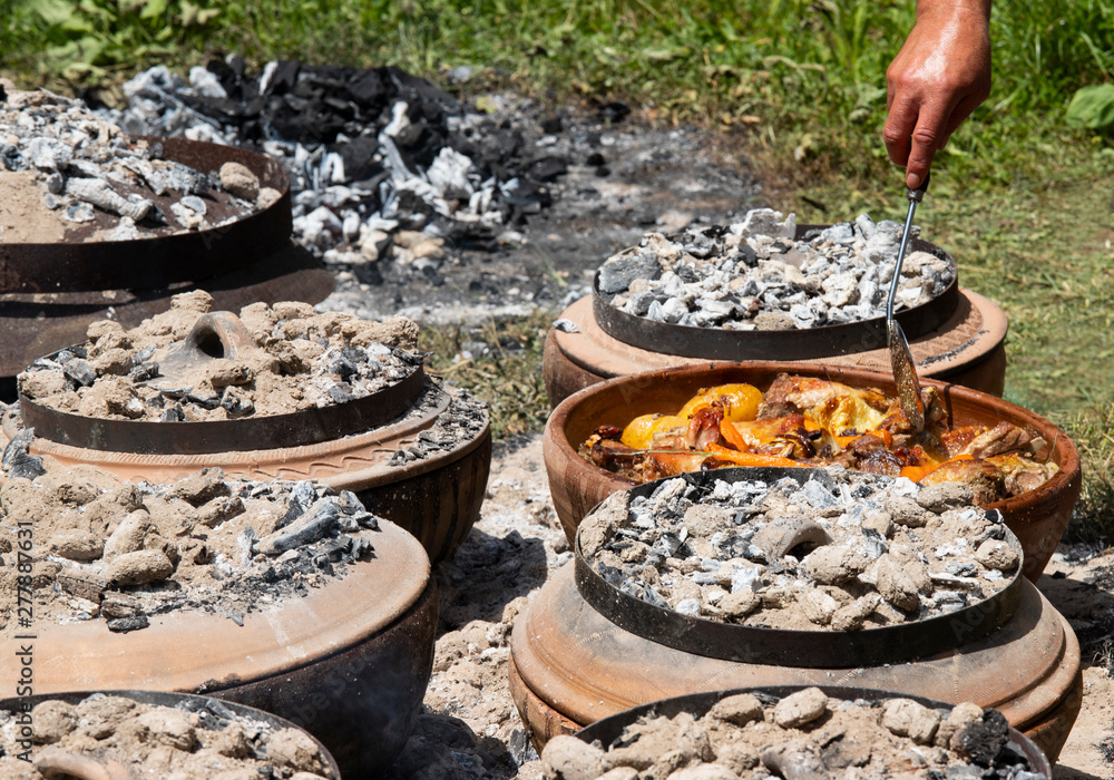 Cooking traditional Balkan, Serbian, Turkish lamb meat with vegetables ...