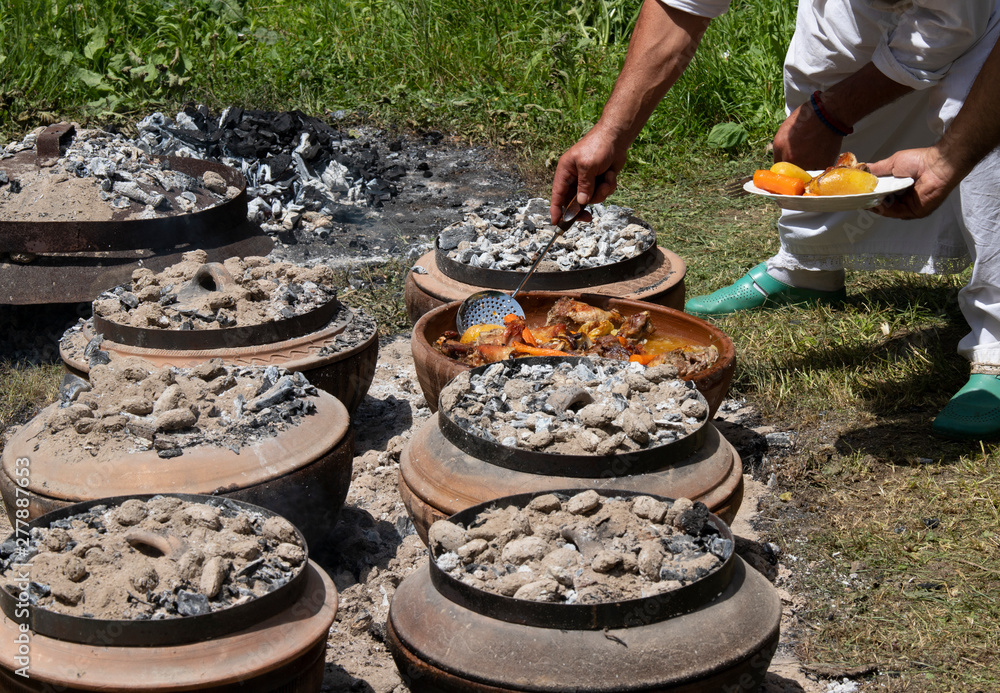 Cooking traditional Balkan, Serbian, Turkish lamb meat with vegetables ...