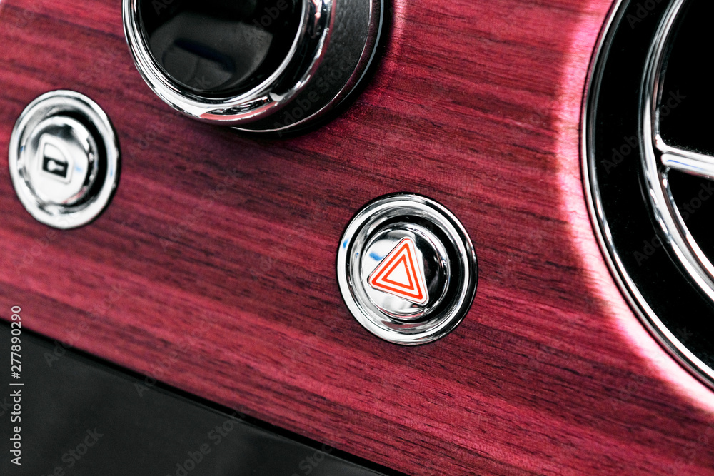 Car hazard warning flashers and emergency button with visible red ...