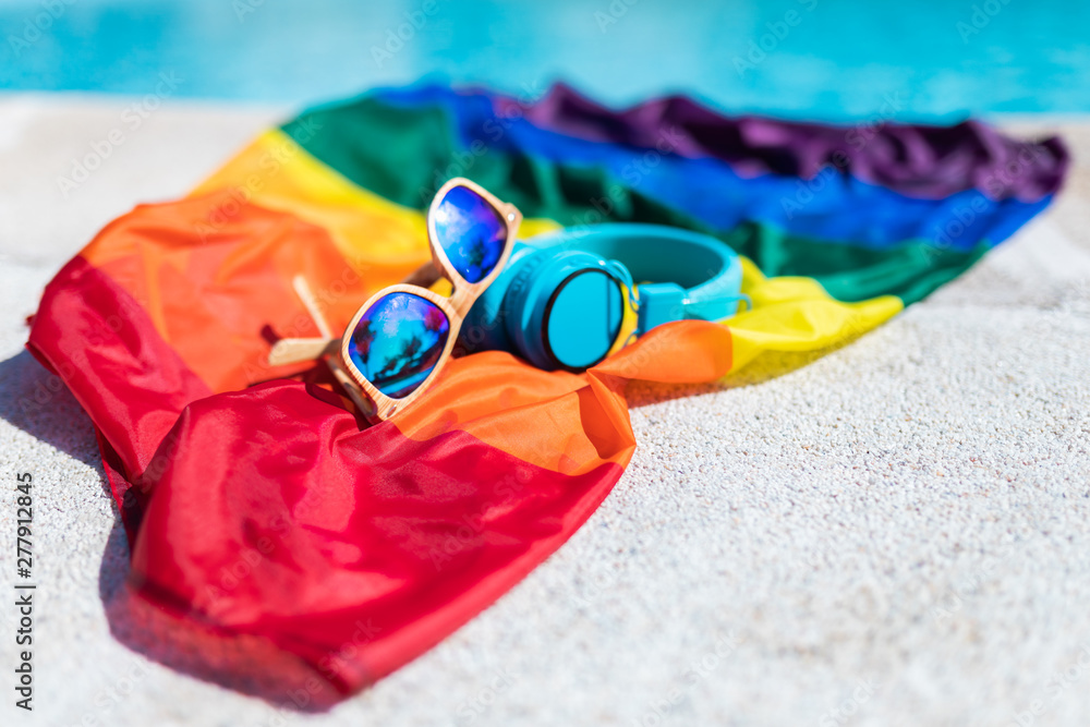 summer pool with blue water and rainbow colored flag Stock Photo ...