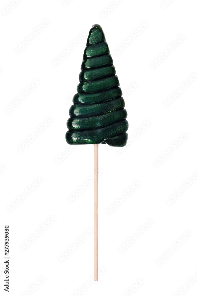 Candy in the shape of a Christmas tree on a white background. Green ...