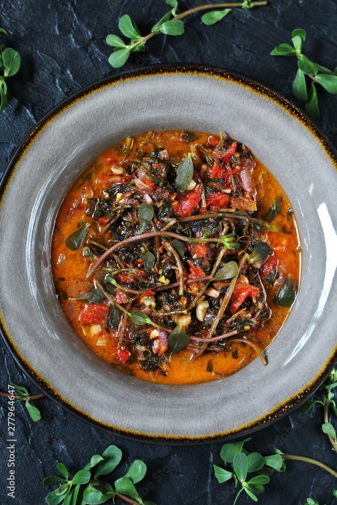dish of purslane. potulak-edible useful weed. stalks of purslane stewed ...