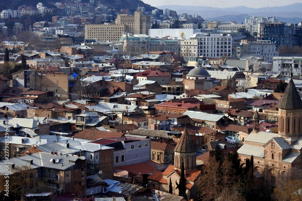 various, colored, beautiful roofs of the city of Tbilisi lit by the ...