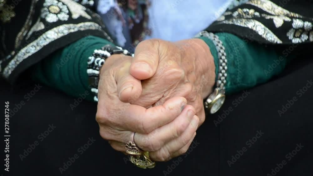 An old ladies hands with gold rings and jewelry. Closeup of old woman's ...