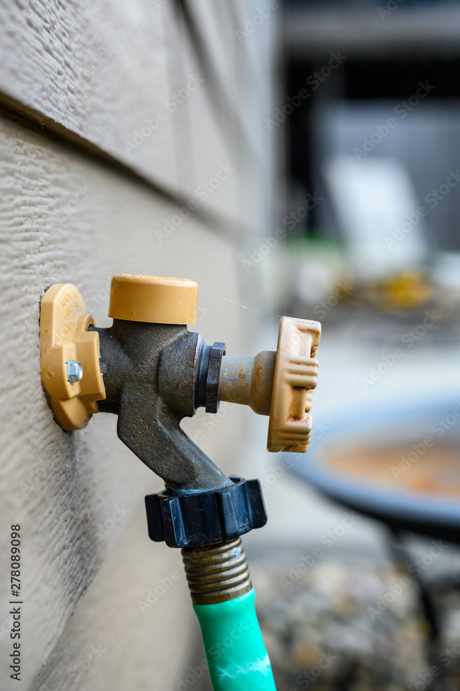 Handle-Operated Freezeless Residential Wall Hydrant mounted on exterior ...