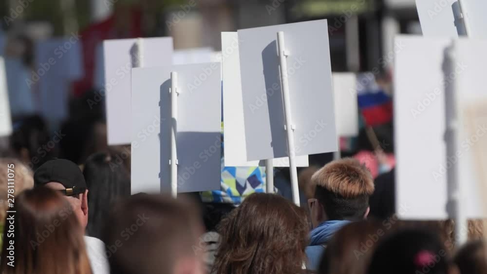 Dissatisfied crowd people go with banner, demonstrating their freedom ...