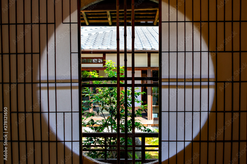 Round window with shoji at a traditional Japanese house in Nara, Japan ...