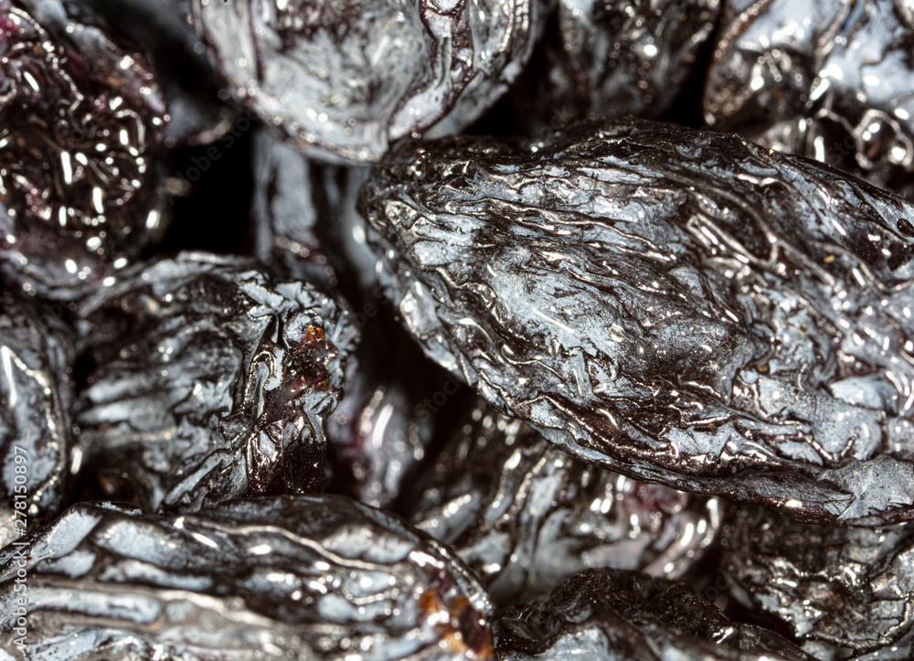 Black dry raisins as background Stock Photo | Adobe Stock