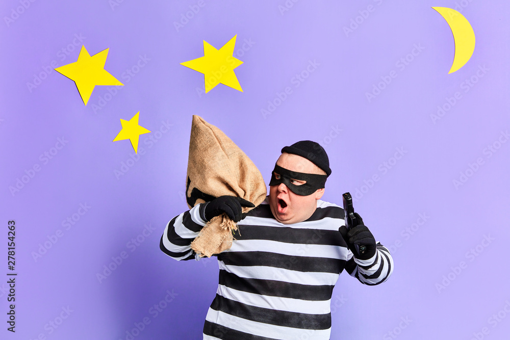 scared man with wide open mouth in mask is being afraid of police ...