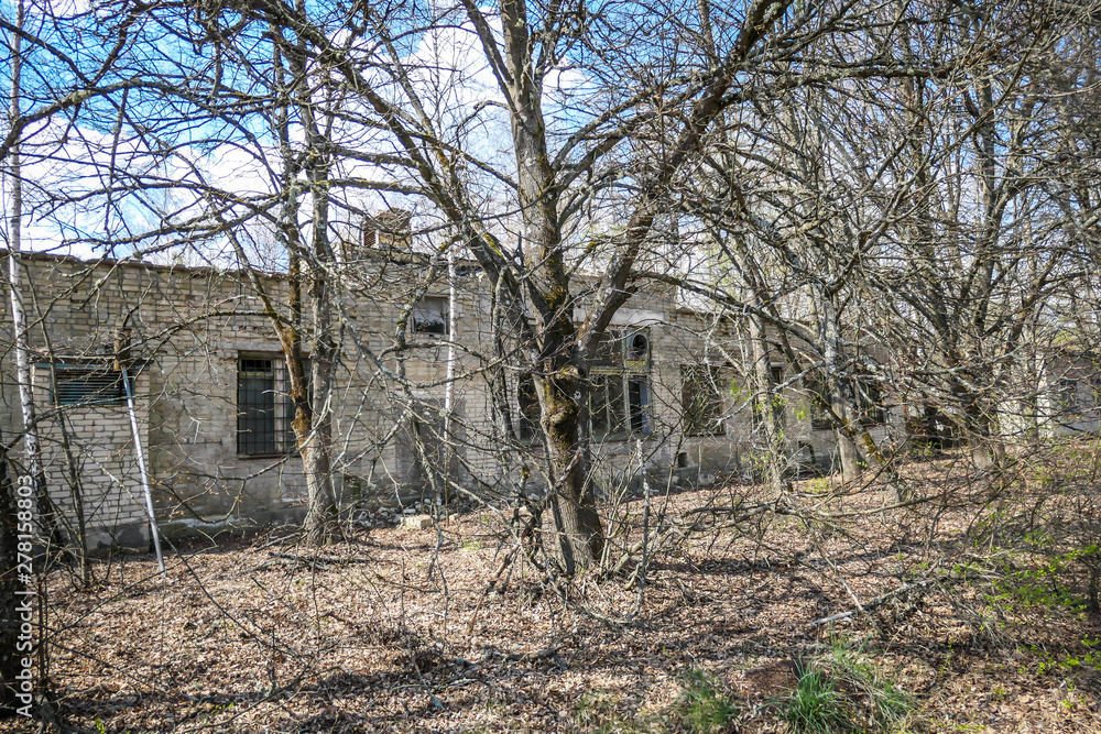 An abandoned warehouse in the forest in the region of Chernobyl ...
