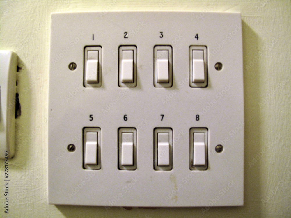 Retro numbered light switches in an old school building Stock Photo ...