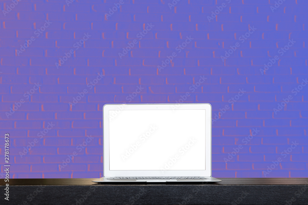 Isolated mockup image of laptop with black wood and computer with neon ...