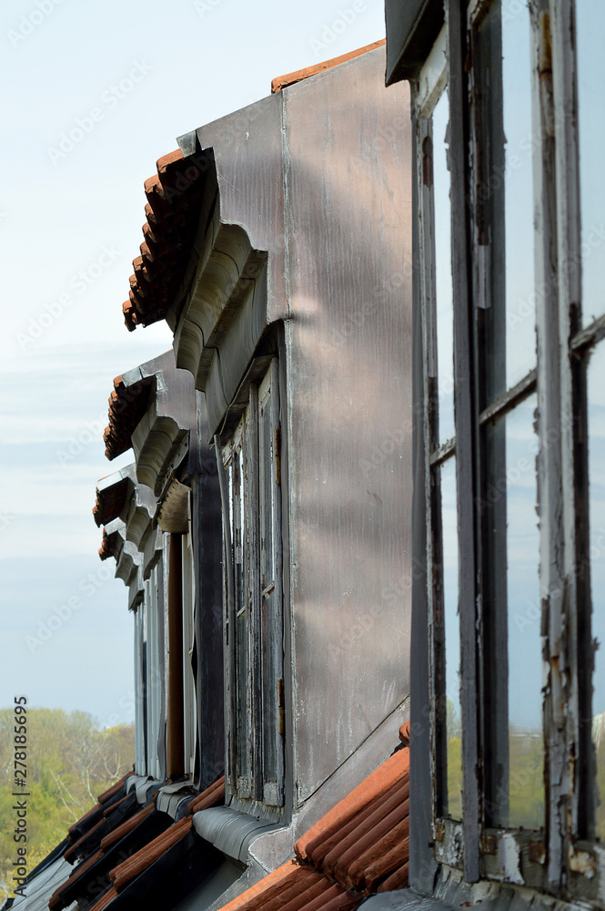 Ancient dormer windows with paint peeling in Warsaw's Old Town, Poland ...