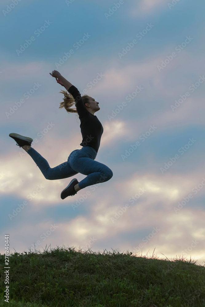 Cheerful Positive Girl Jumping in the Air Outdoor Morning Clouds ...