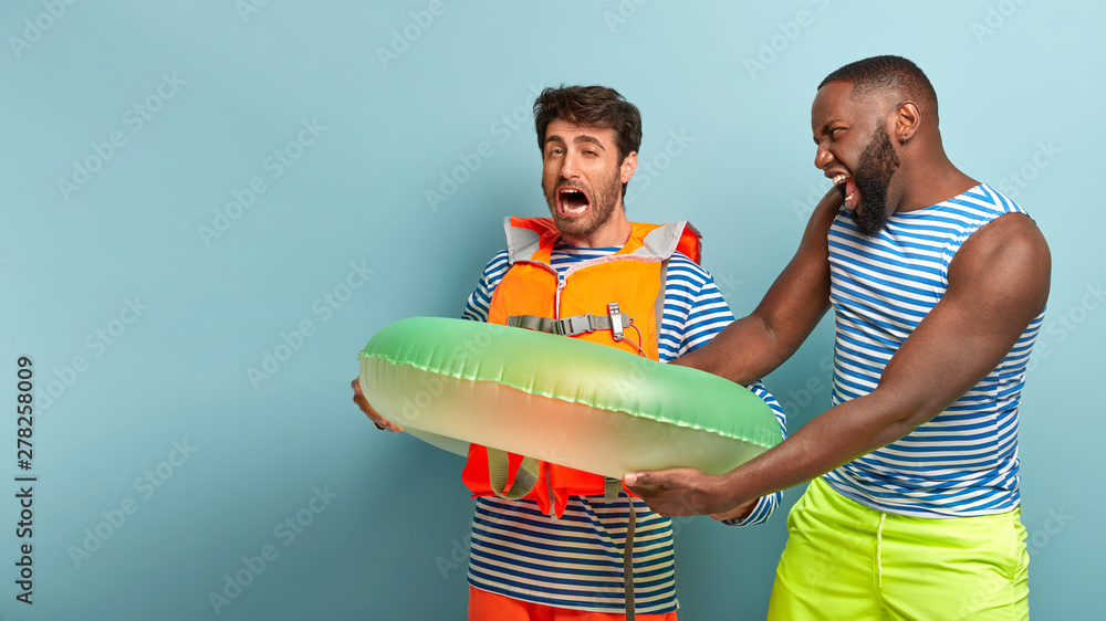 Greedy man doesnt want to share swimring with friend. Angry dark ...