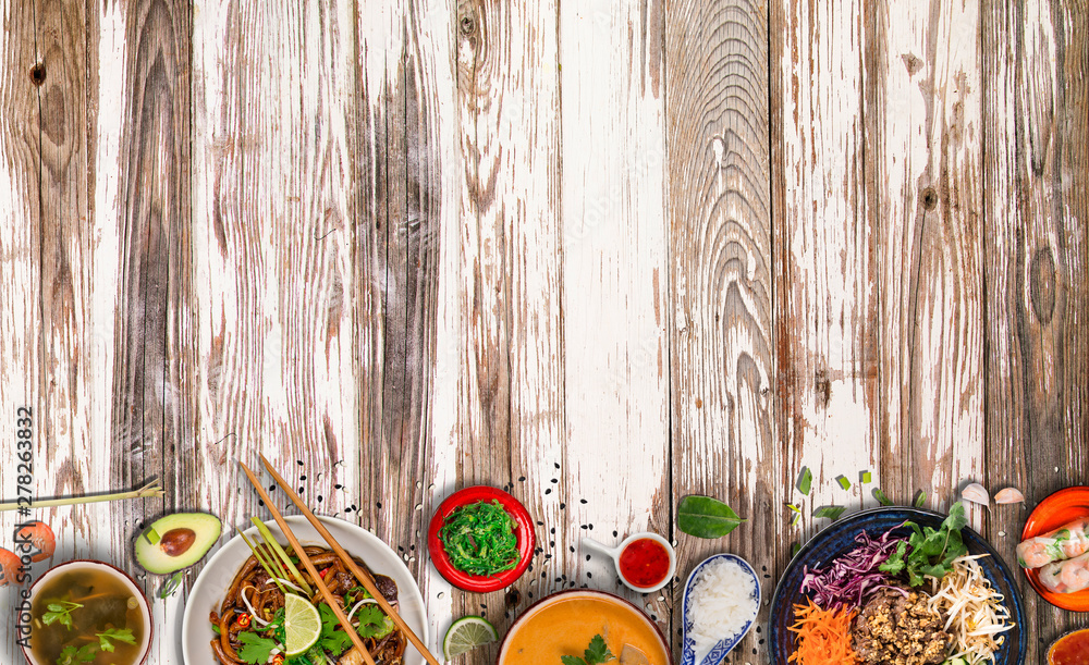 Asian food background with various ingredients on rustic wooden ...