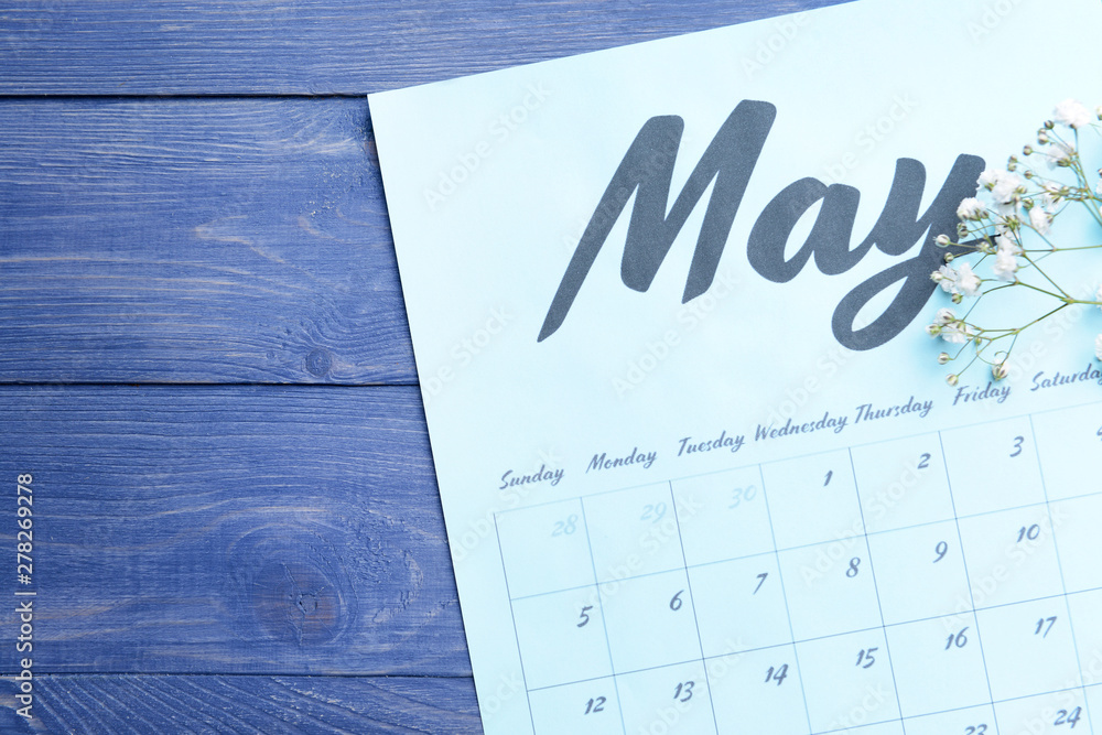 Paper calendar and flowers on color wooden background Stock Photo ...