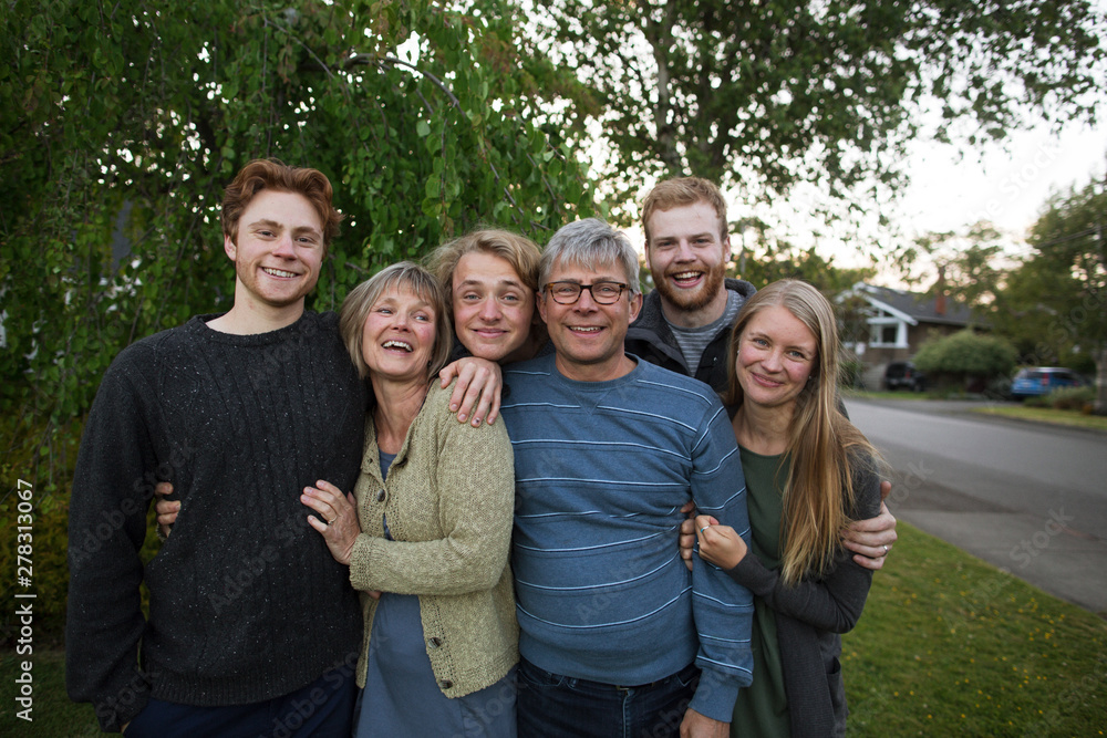 Smiling portrait of family with grown up kids outside together Stock ...