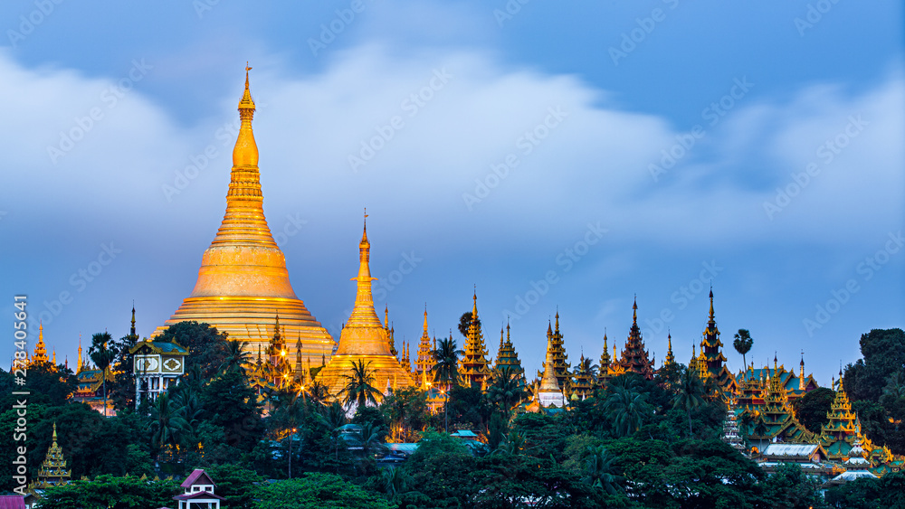 Shwedagon Pagoda at morning in Yagon City with blue sky background ...