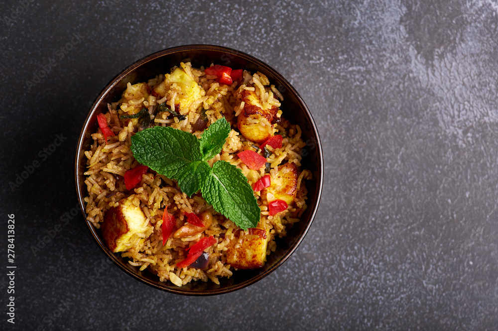 vegetarian paneer biryani at black background. paneer biryani is ...