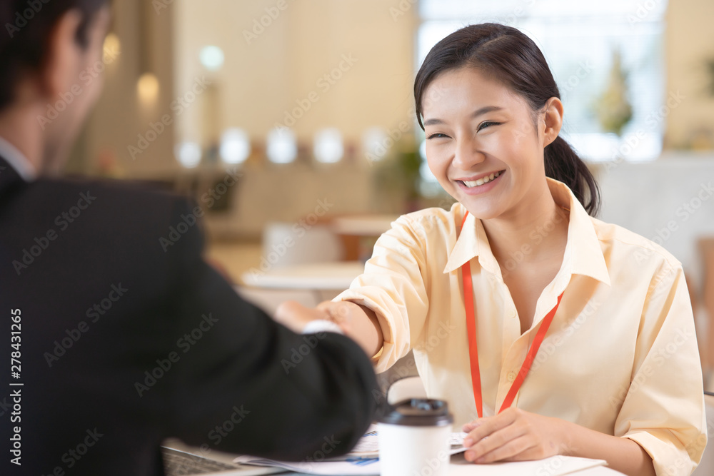Portrait young Asian woman interviewer and interviewee shaking hands ... Portrait young Asian woman interviewer and interviewee shaking hands ...