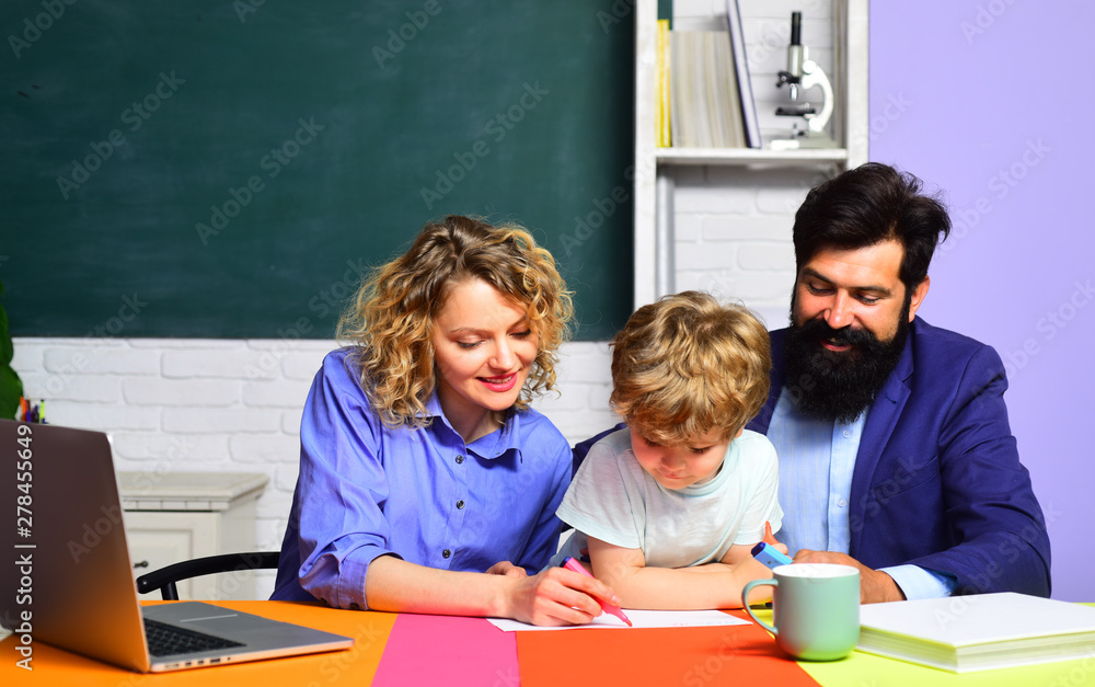 Parenting. Happy family. Cute pupil and his parents making schooling ...