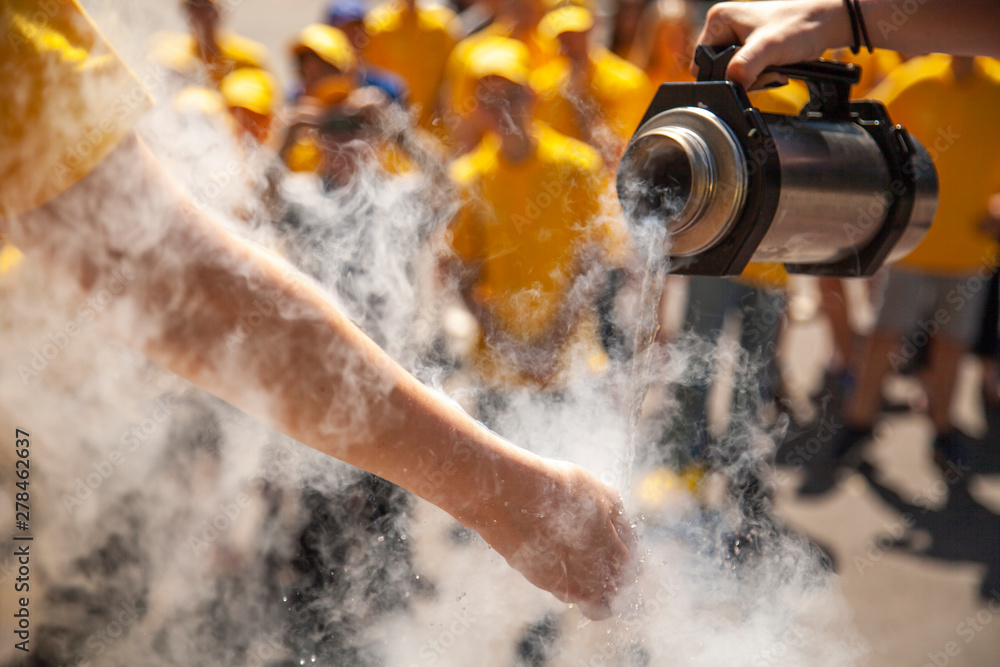 Experiment with dry ice. Hand doused with nitrogen. Physical ...