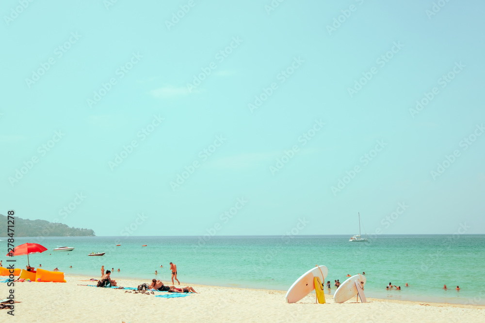 Far away image shot and blurred face of crowd people on sand beach with ...