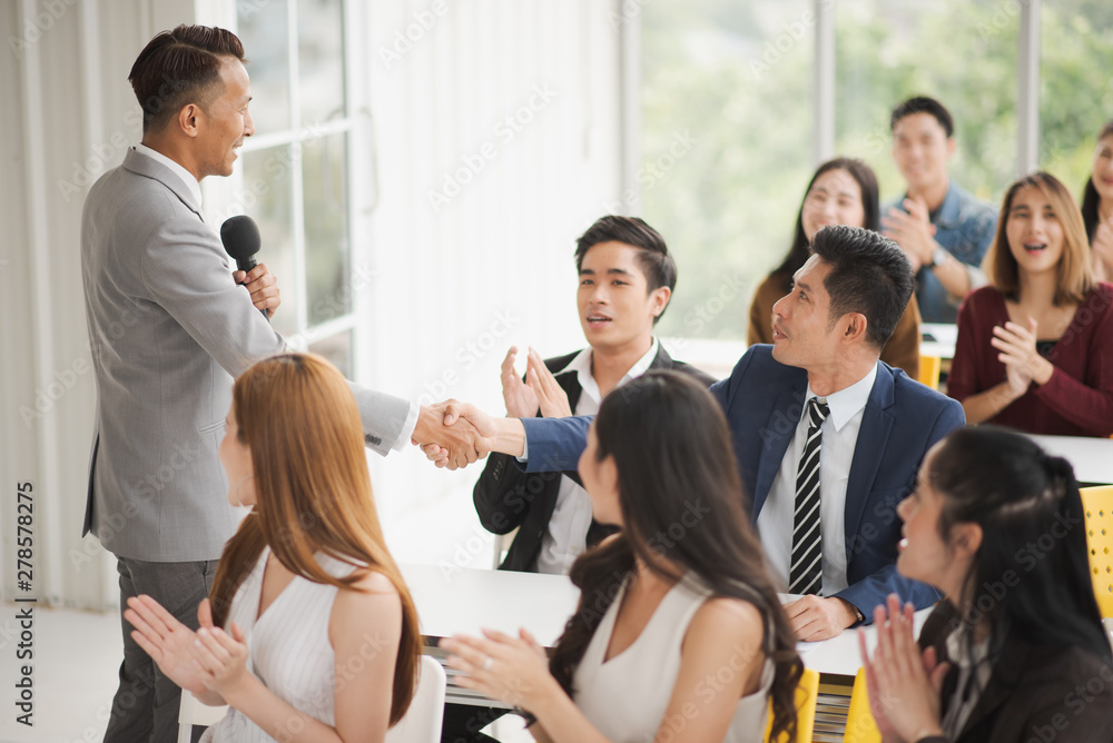 Young Asian business people seminar group are listening the speaker and ...