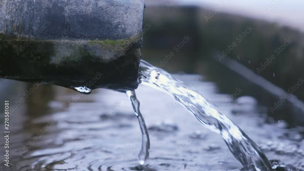 Discharge of dirty industrial sewage wastewater into a city canal on ...
