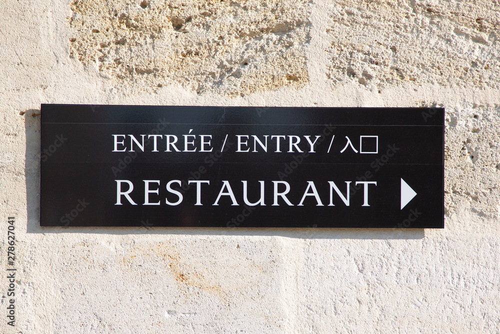 arrow sign restaurant entry in multilingual Stock Photo | Adobe Stock
