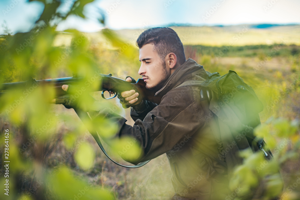 Hunter with shotgun gun on hunt. Hunter with Powerful Rifle with Scope ...