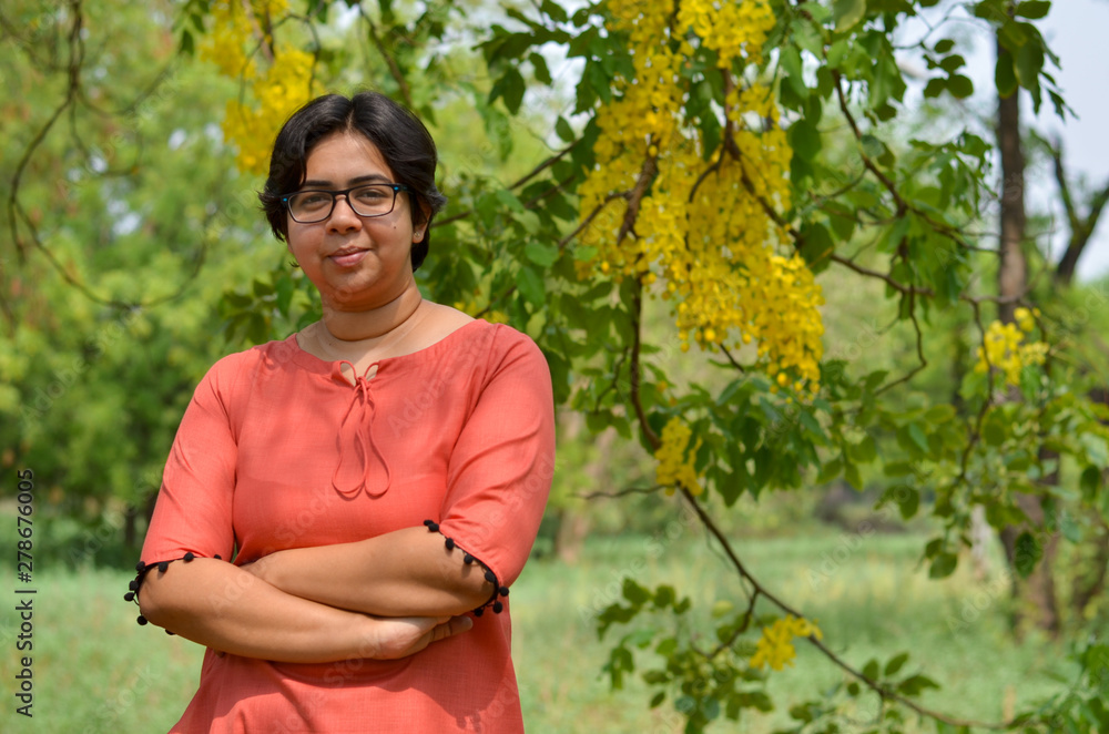 Portrait of a confident looking young Indian woman with short hair ...