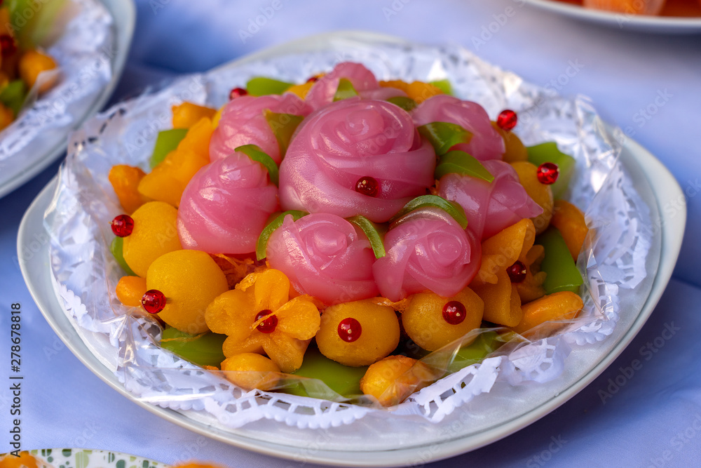 Thai sweet cake. Thai traditional dessert in pink rose flowers shaped ...