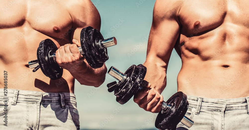 Muscles with dumbbell. Man training with dumbbells. Strong bodybuilder ...