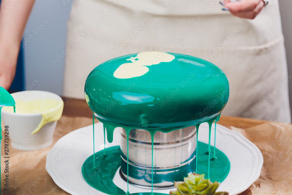 Mousse yogurt cake. Girls cook and creat a drawing of mousse on the ...