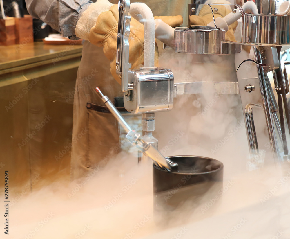 Making desert with dry ice in kitchen Stock Photo | Adobe Stock